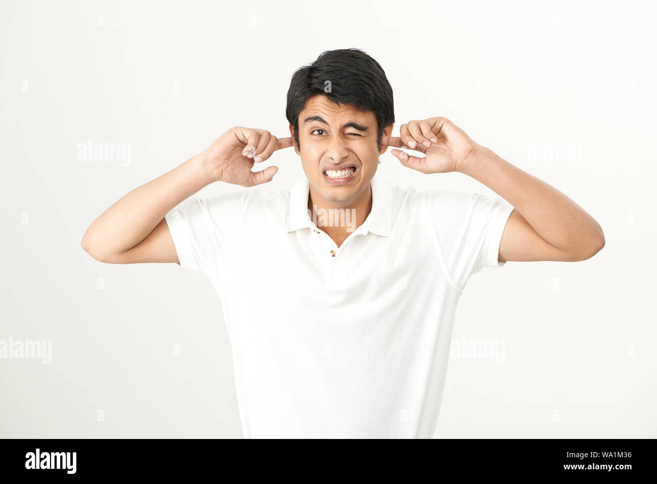 Fingers in ears man hi-res stock photography and images - Alamy