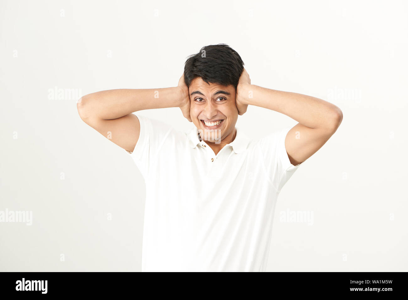 Man hands on ears hi-res stock photography and images - Alamy