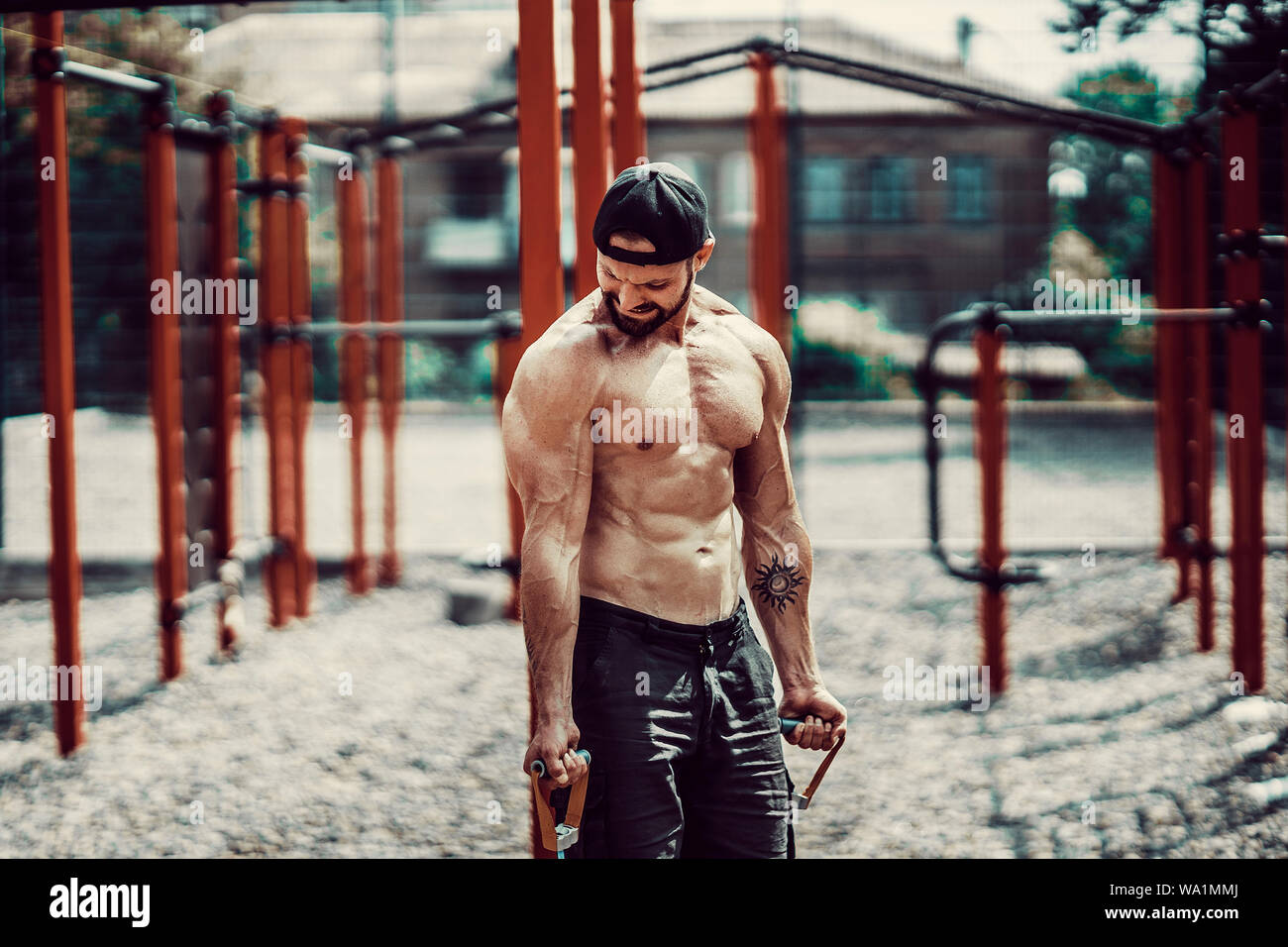 Fitness man exercising with stretching band. Muscular sports man ...