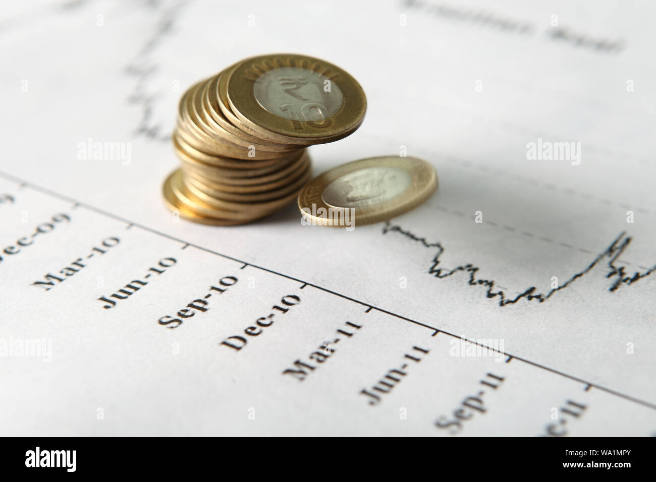 Line graph coins representing hi-res stock photography and images - Alamy