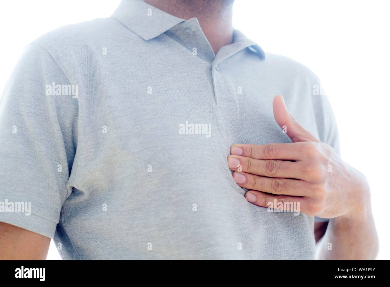 Man touching his chest in pain Stock Photo - Alamy