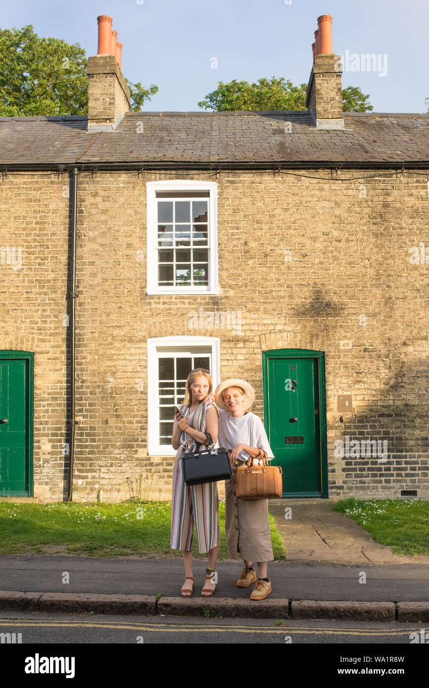 Cambridge, UK - June 2019: Young women student couple in front of ...