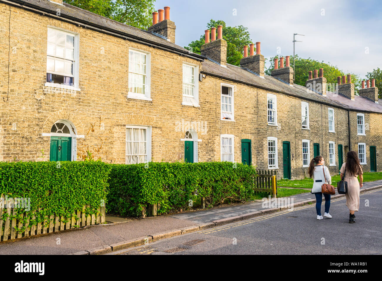 Cambridge, UK - June 2019: Young women couple walking in front of ...