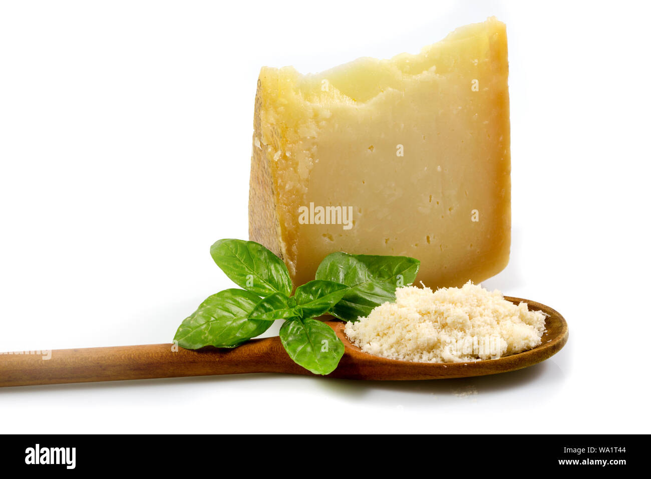 piece of cheese or Italian cheese with fresh green basil isolated on ...