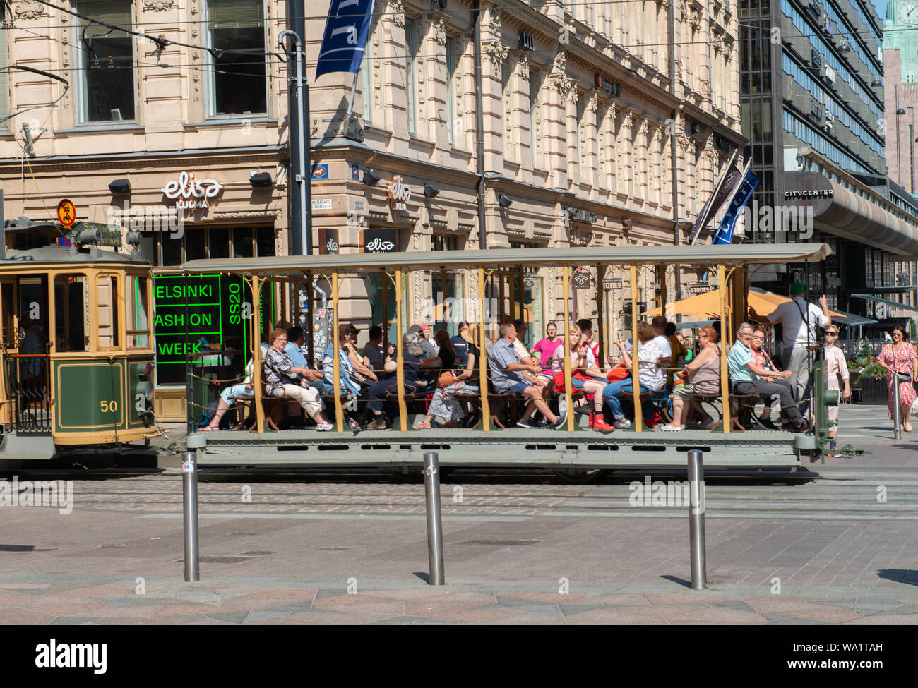 People on a moving open tram on aleksanterinkatu street Helsinki Stock ...