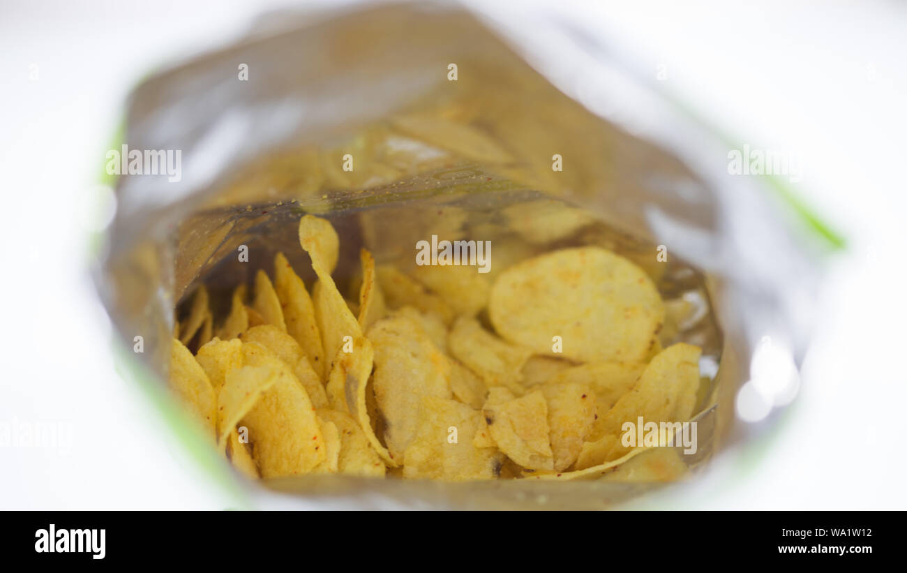 Potato chips in bag, Chips ready to eat in the bag, snack background ...