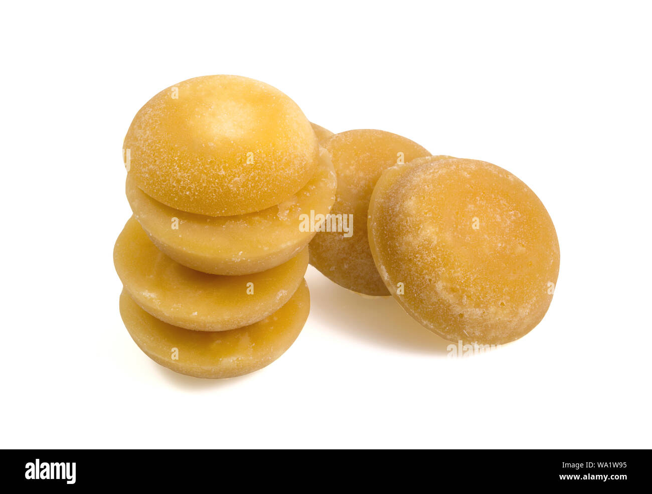 Palm sugar, sugar cubes isolated on white background Stock Photo - Alamy