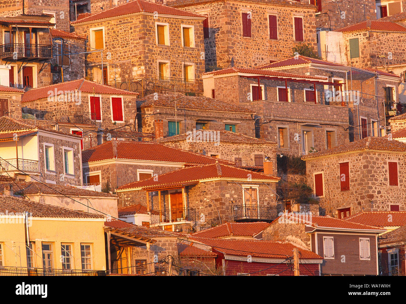 Greece. Lesbos. Mithymna. Houses built on cliffside Stock Photo - Alamy