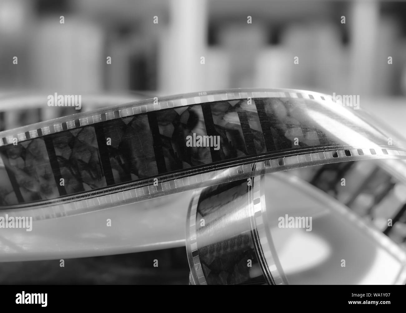 Old cine-film. Film strip on a blur background. Black and white photo ...