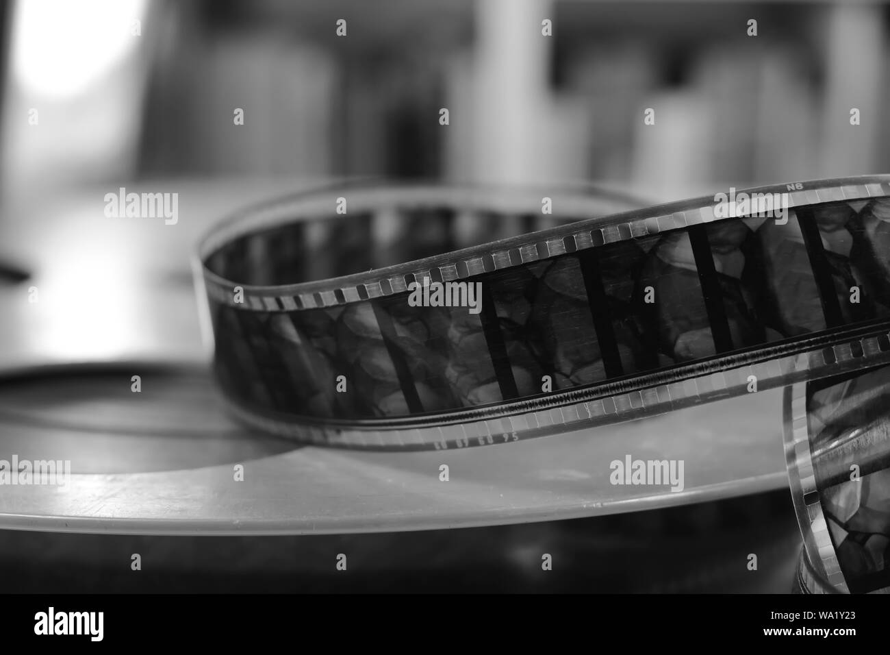 Old cine-film. Film strip on a blur background. Black and white photo ...