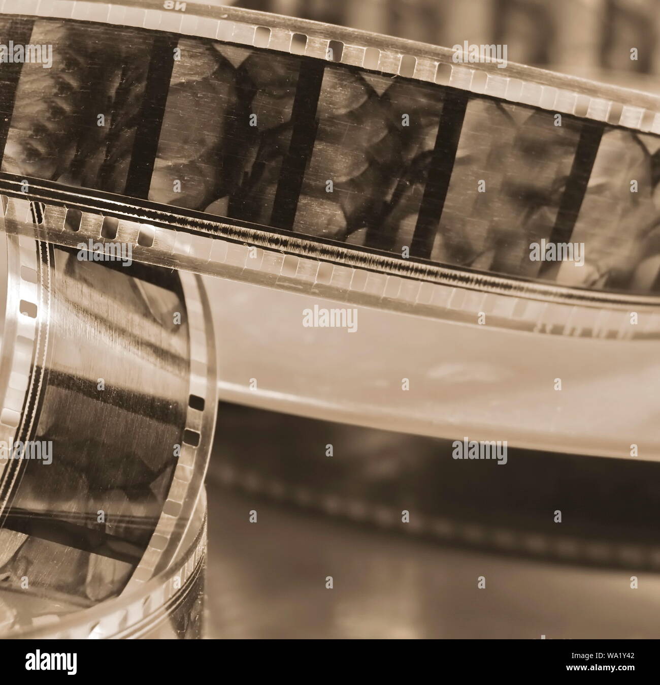 Old cine-film. Film strip on a blur background. Sepia photo Stock Photo ...