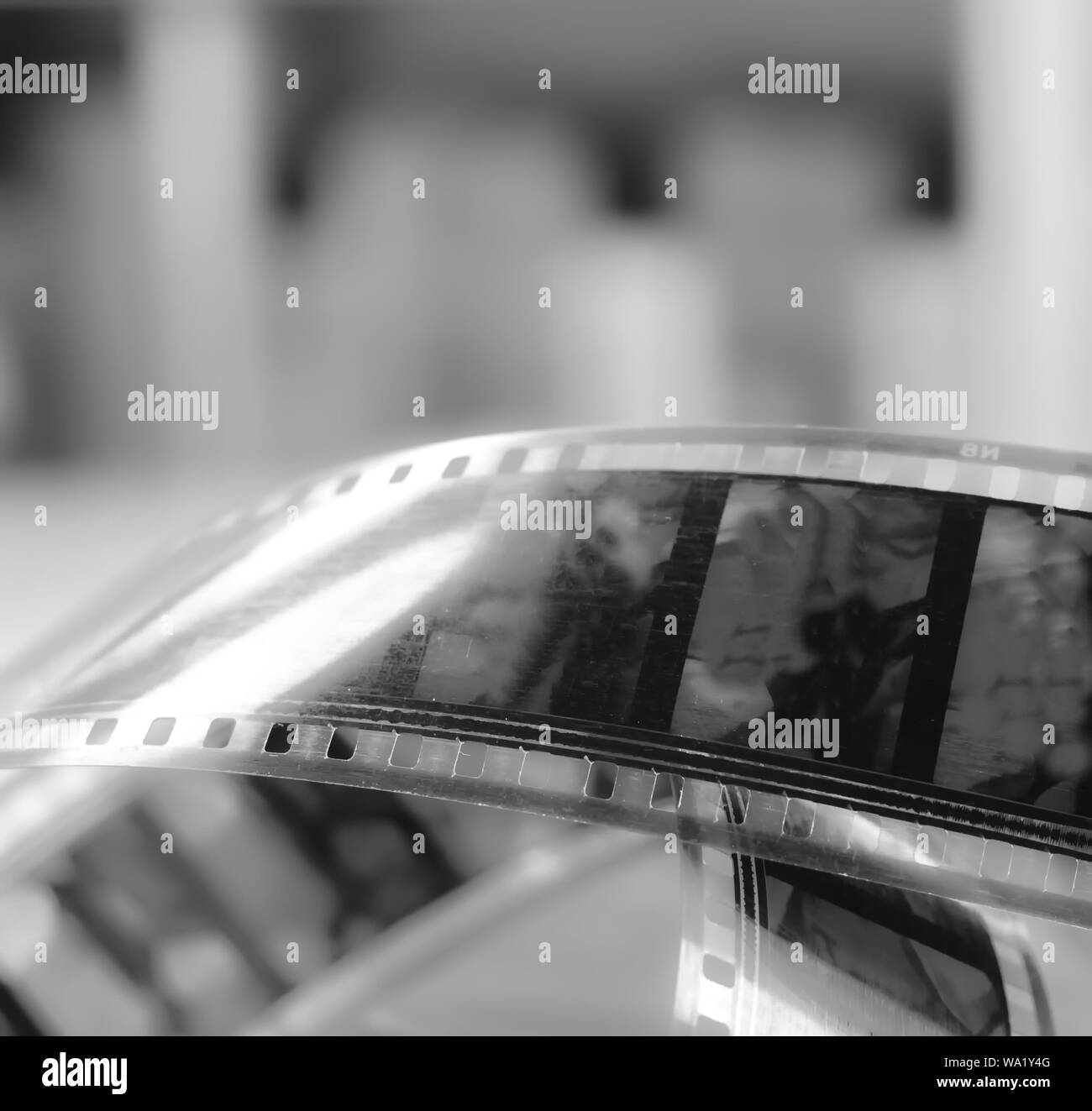 Old cine-film. Film strip on a blur background. Black and white photo ...