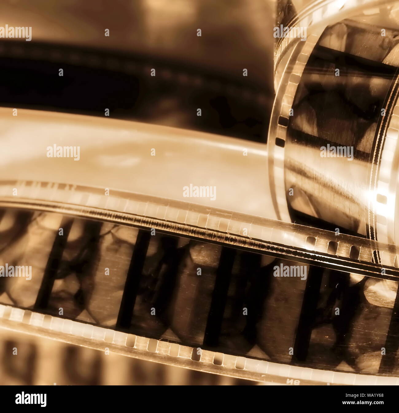 Old cine-film. Film strip on a blur background. Sepia photo Stock Photo - Alamy