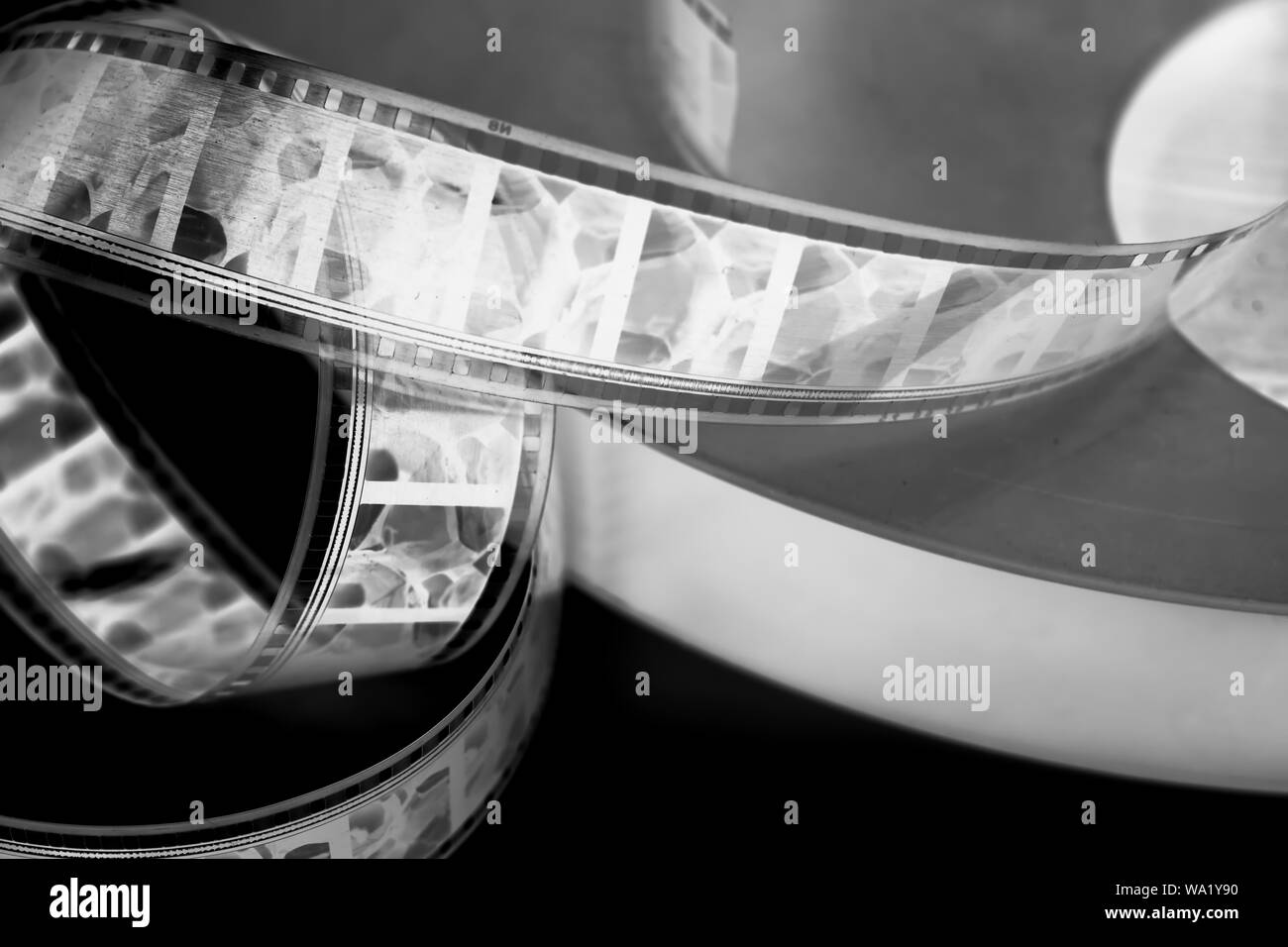 Old cine-film. Film strip on a blur background. Black and white photo ...