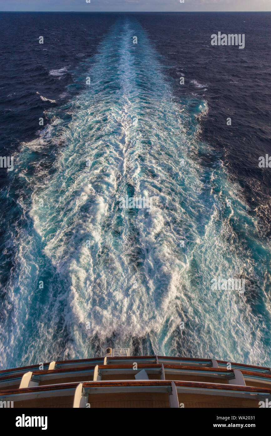 View of the stern of a cruise ship and the foam wake left by the ...