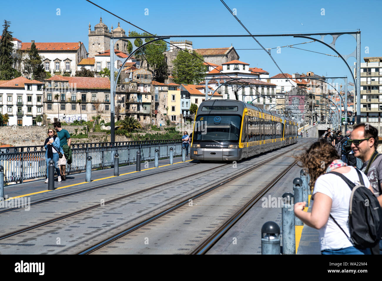 Modern light rail tram over the Dom Luis bridge in Porto city, Portugal ...