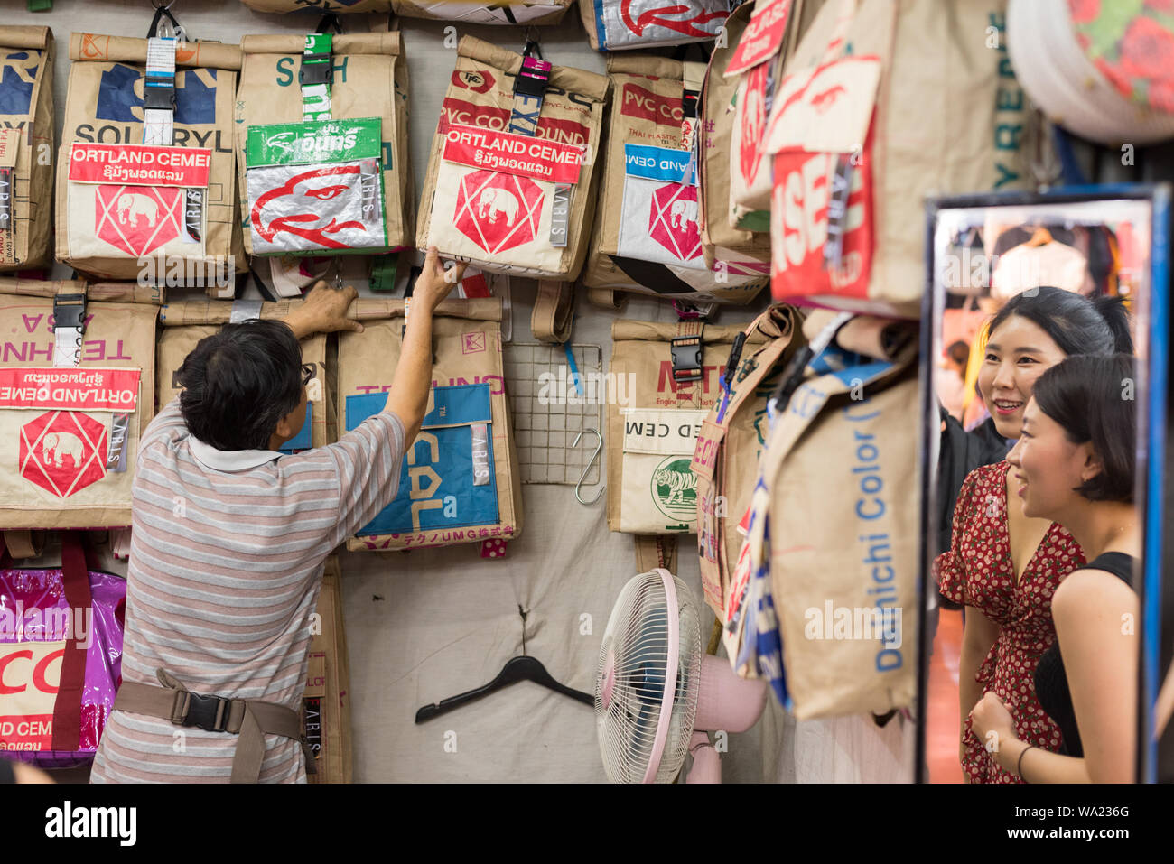 Bangkok, Thailand - June 23, 2019: Asian girls (reflected in the mirror ...