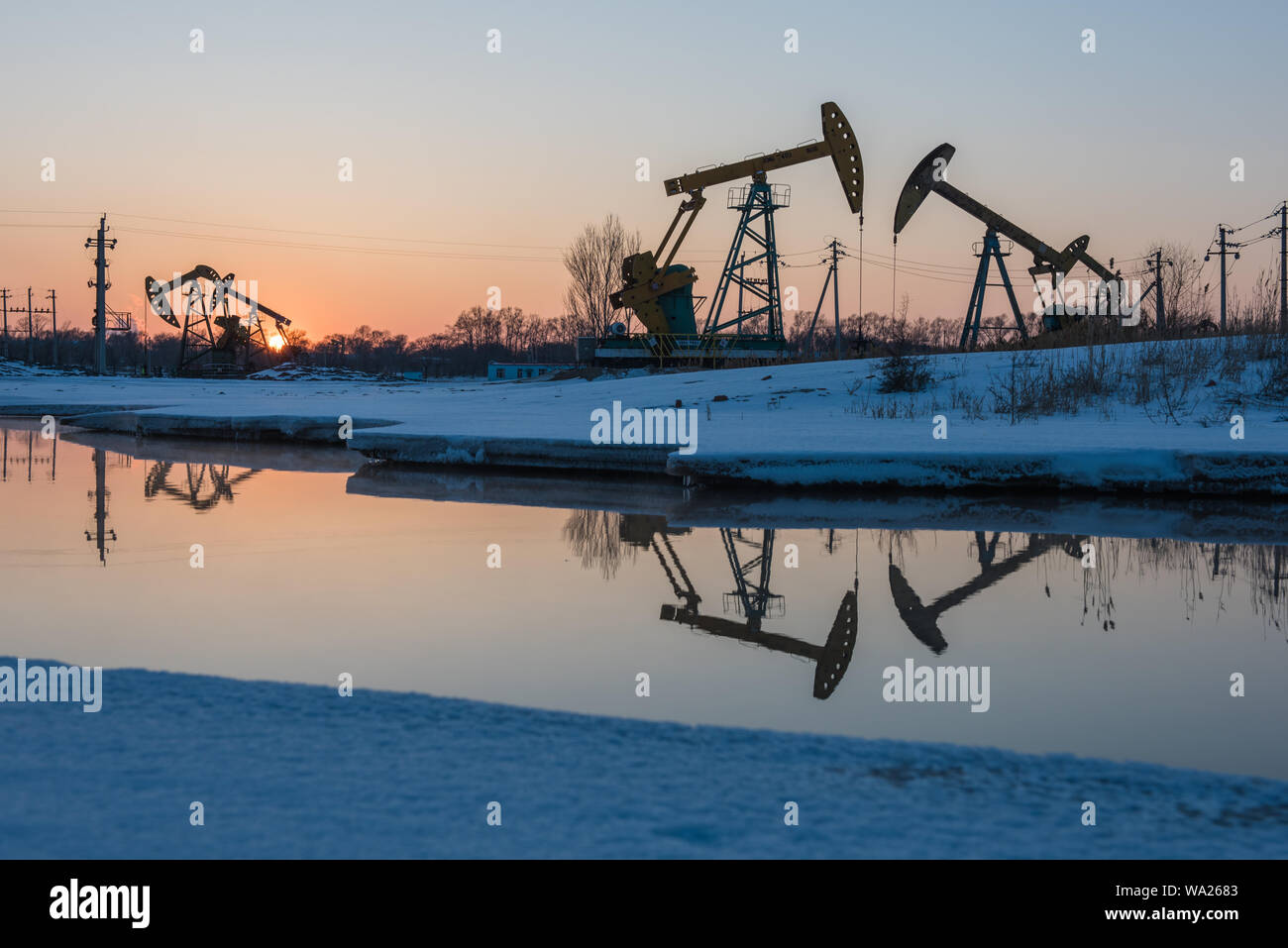 Winter beam pumping unit Stock Photo - Alamy