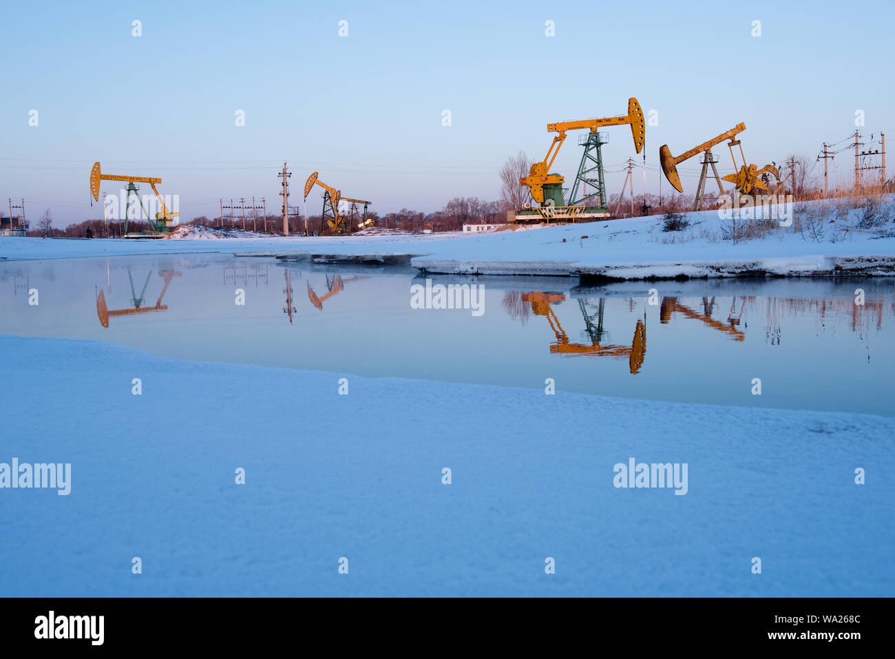 Winter beam pumping unit Stock Photo - Alamy