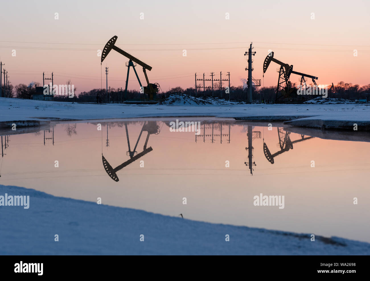 Winter beam pumping unit Stock Photo - Alamy