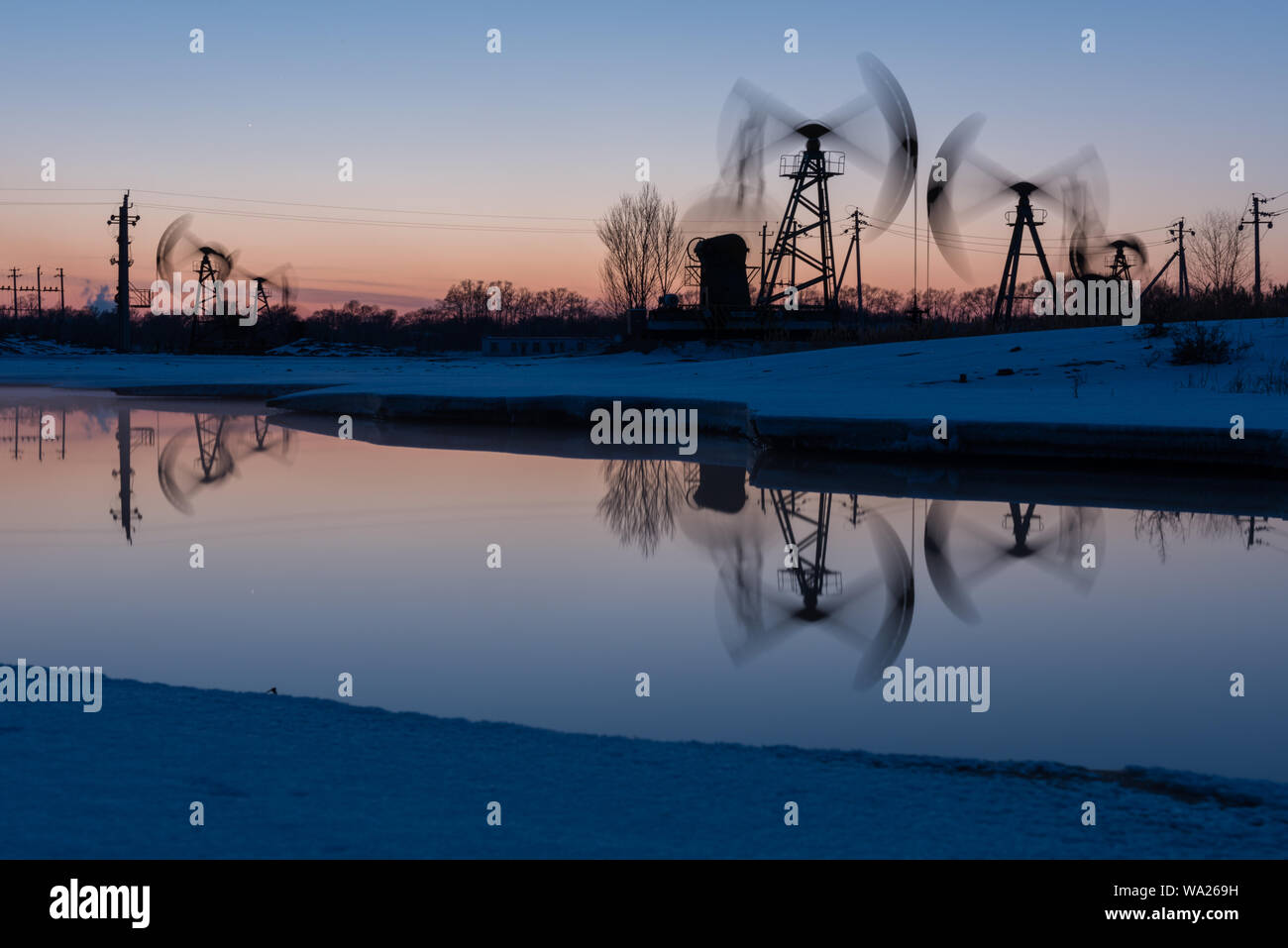 Winter beam pumping unit Stock Photo - Alamy