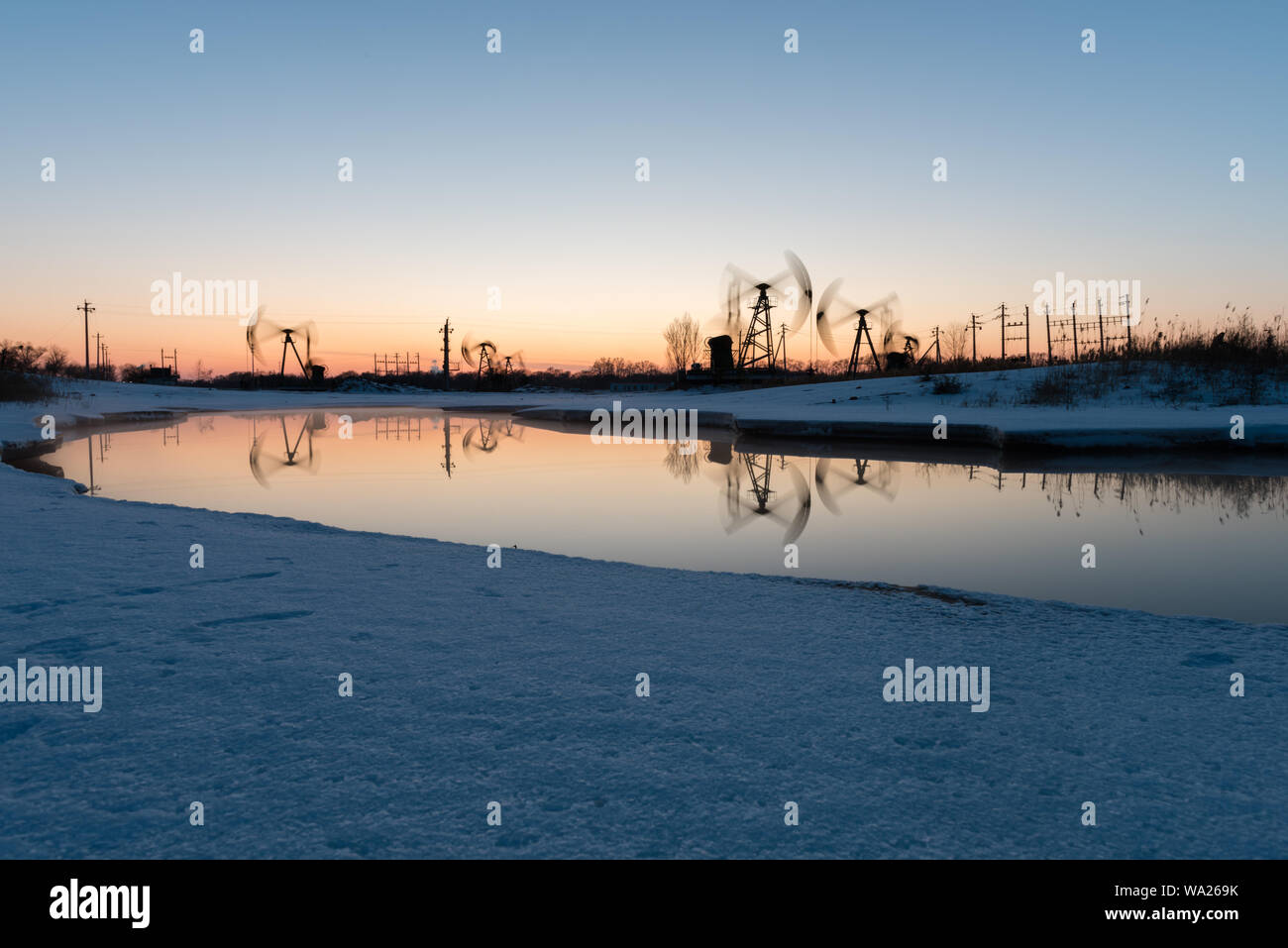 Winter beam pumping unit Stock Photo - Alamy