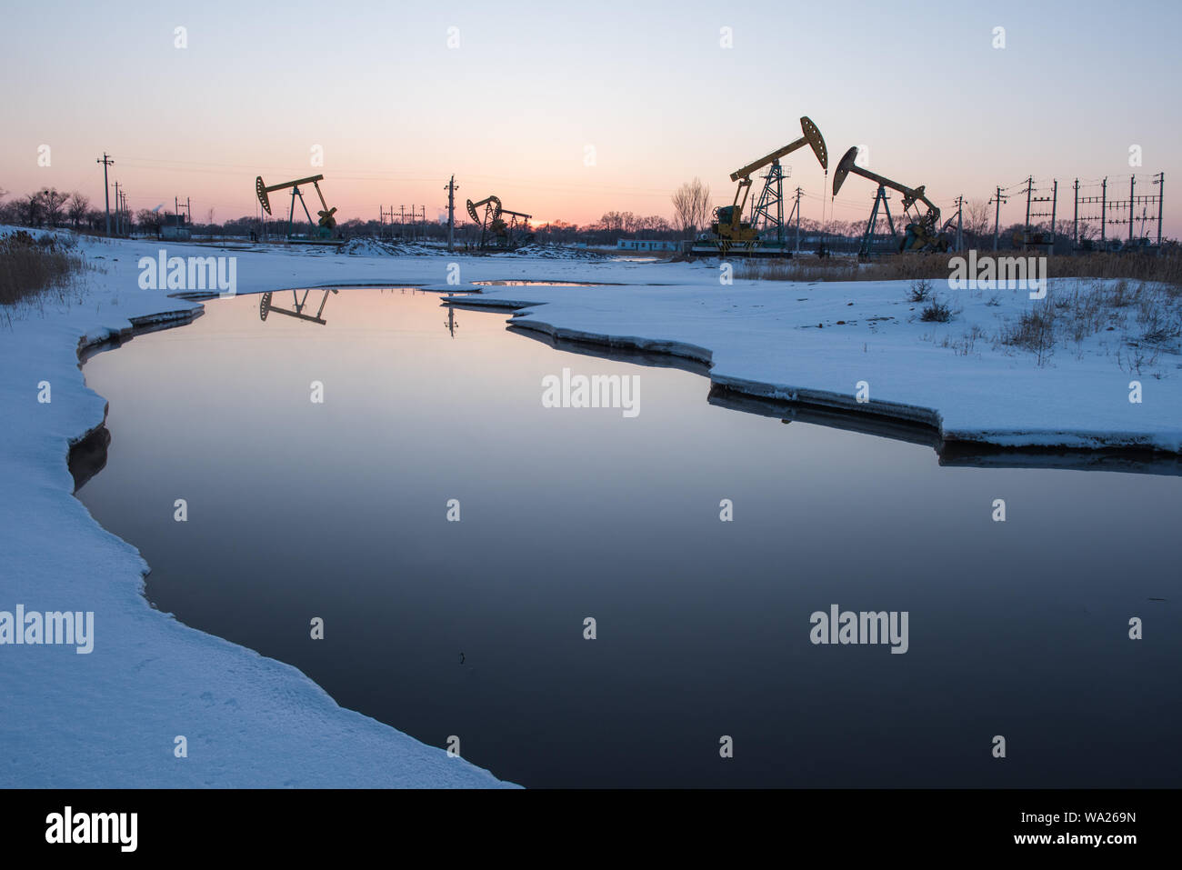 Winter beam pumping unit Stock Photo - Alamy