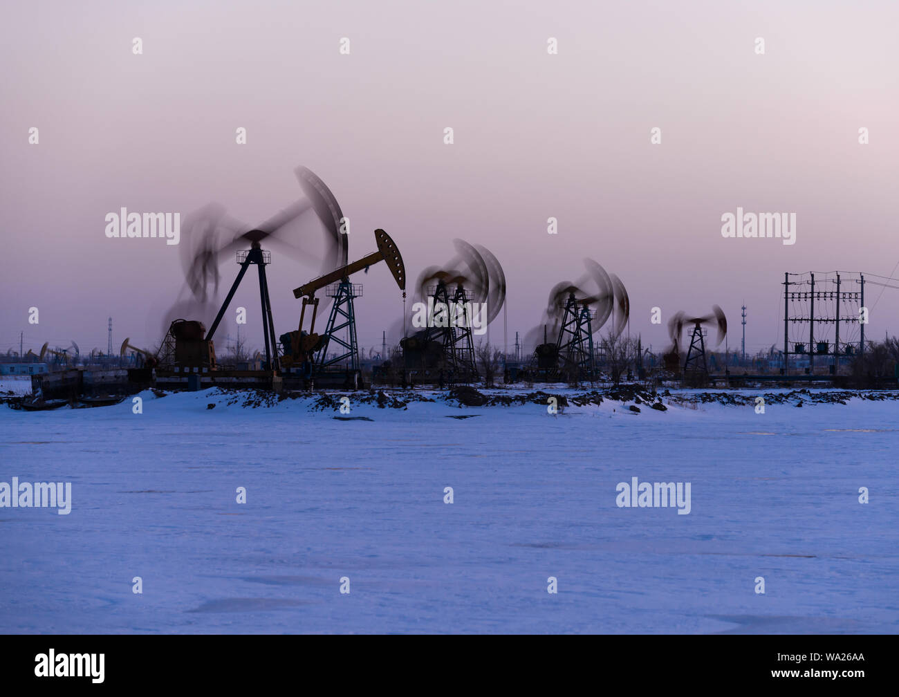 Winter beam pumping unit Stock Photo - Alamy
