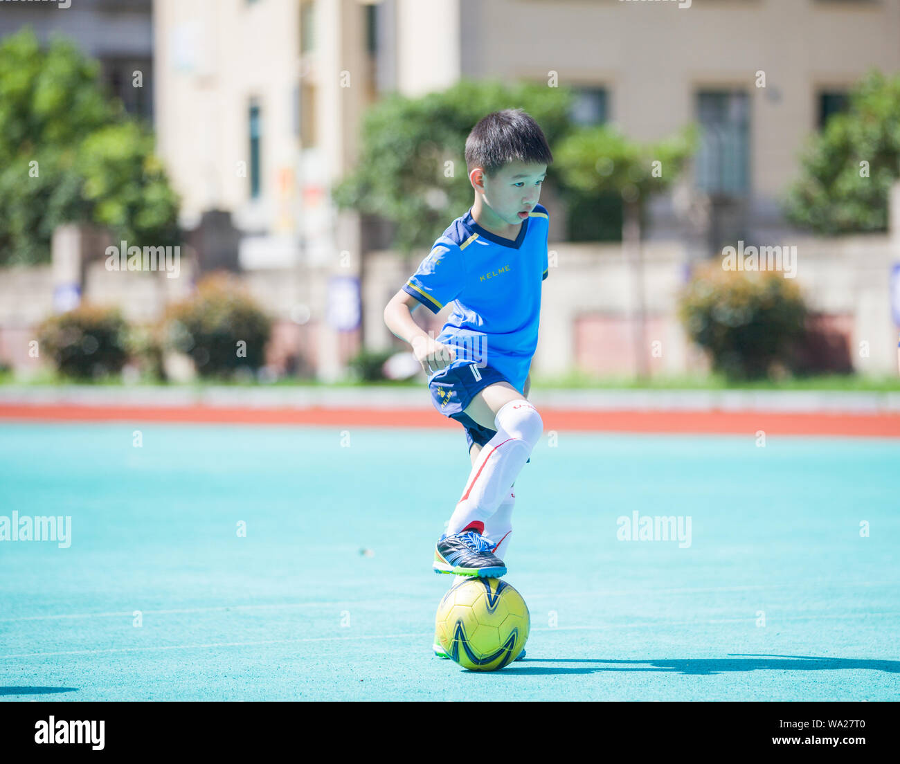 The children playing football Stock Photo - Alamy