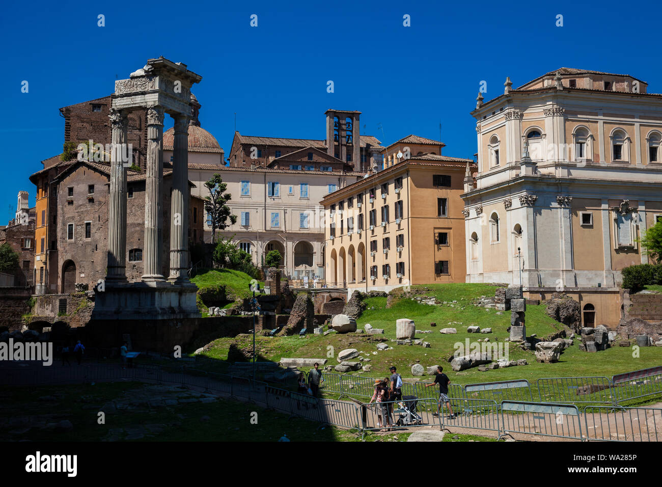 ROME, ITALY - APRIL, 2018: Tourists at the ruins of the Temple of ...