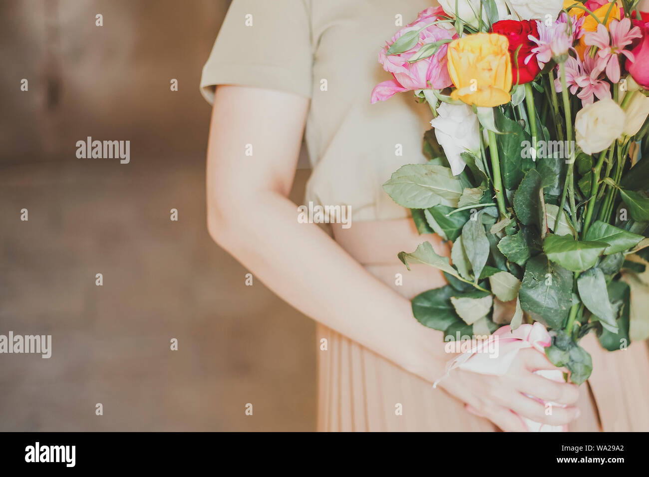 Beautiful middle-eastern girl with a bouquet of flowers. Young ...