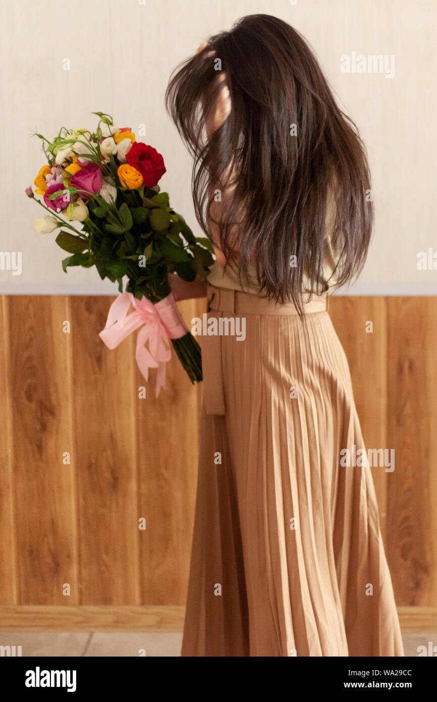 Beautiful middle-eastern girl with a bouquet of flowers. Young ...