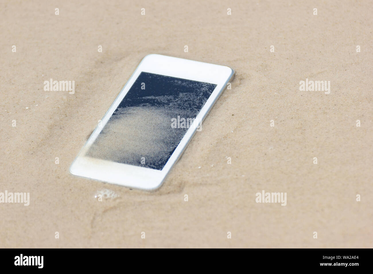 White Mobile phone floated to the sea at the beach Stock Photo - Alamy