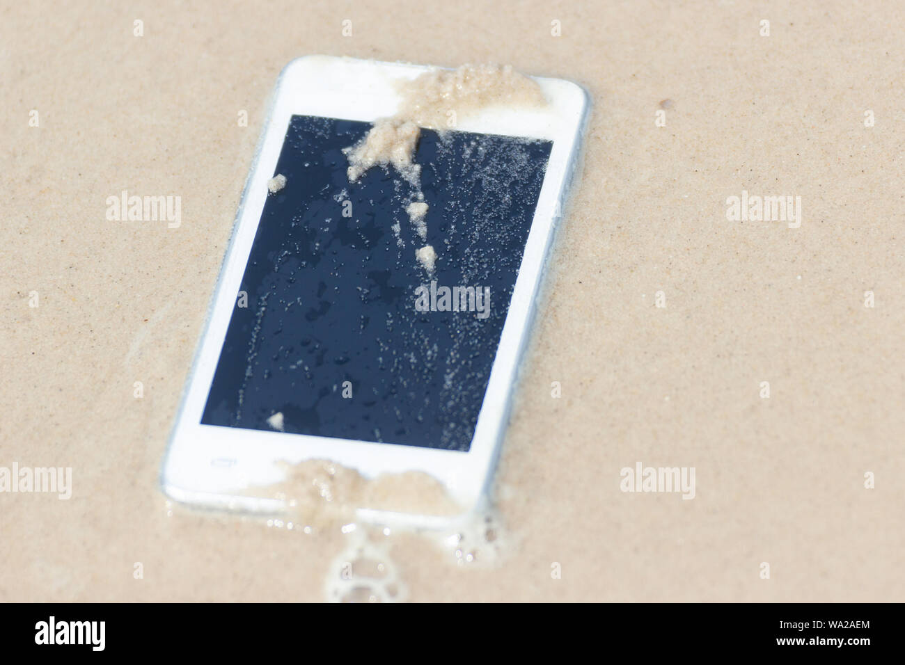 White Mobile phone floated to the sea at the beach Stock Photo - Alamy