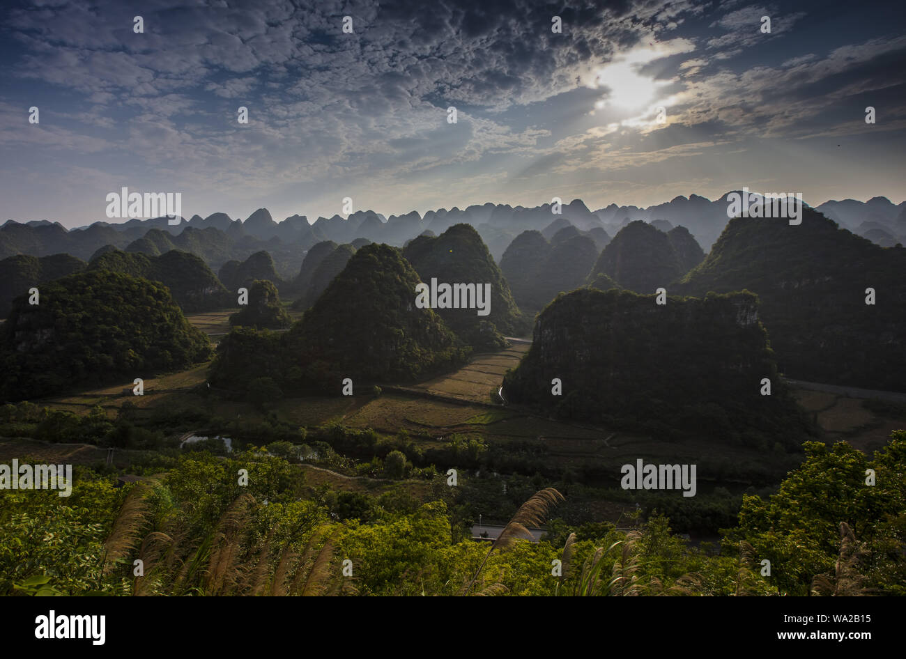 , xingyi, guizhou hoodoo, mountains jade green, rice paddies, ancient ...