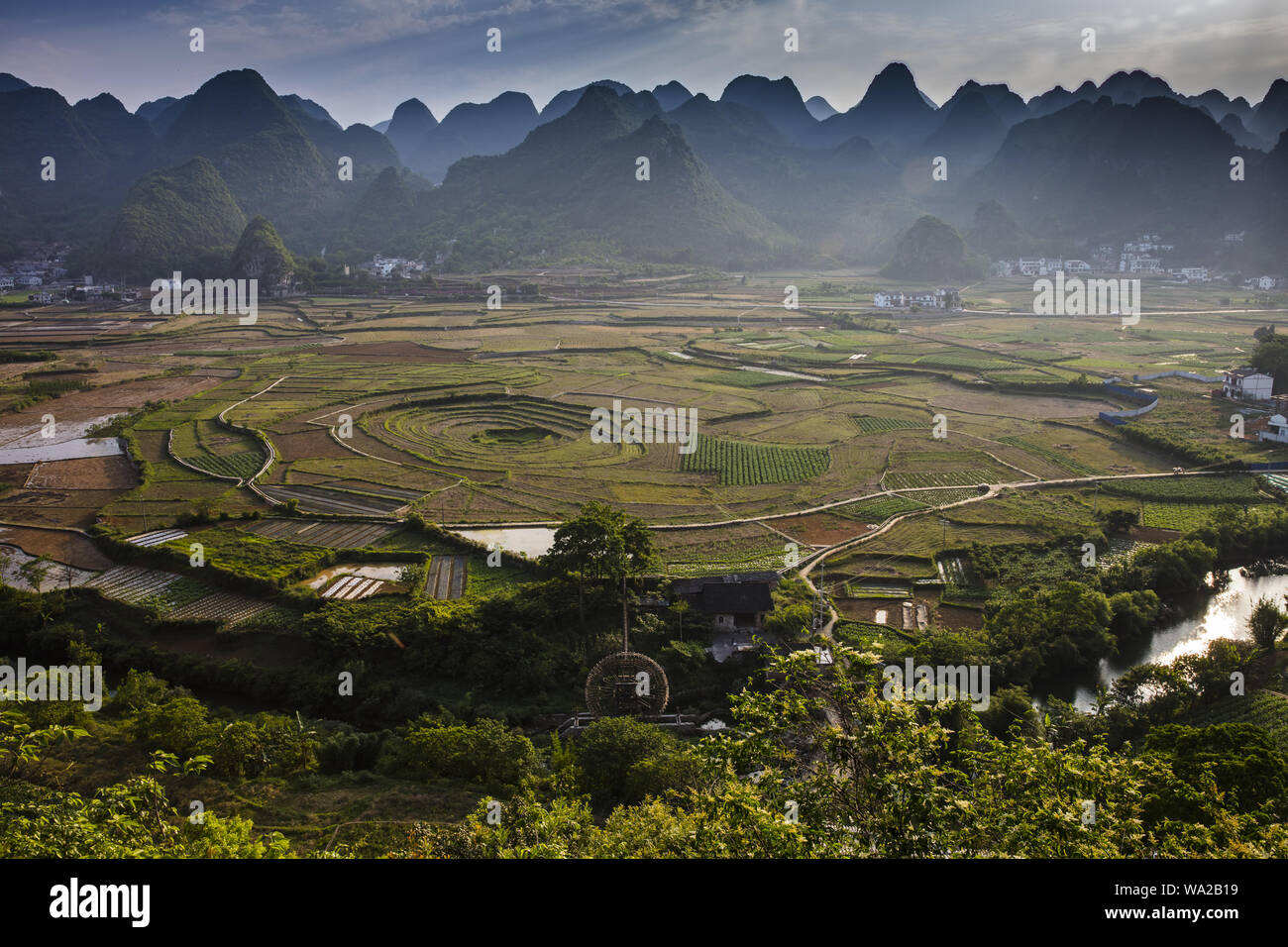 , xingyi, guizhou hoodoo, mountains jade green, rice paddies, ancient ...