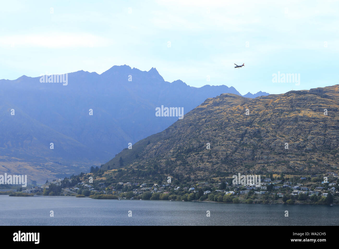 View of Plane landing in Queenstown, New Zealand Stock Photo - Alamy