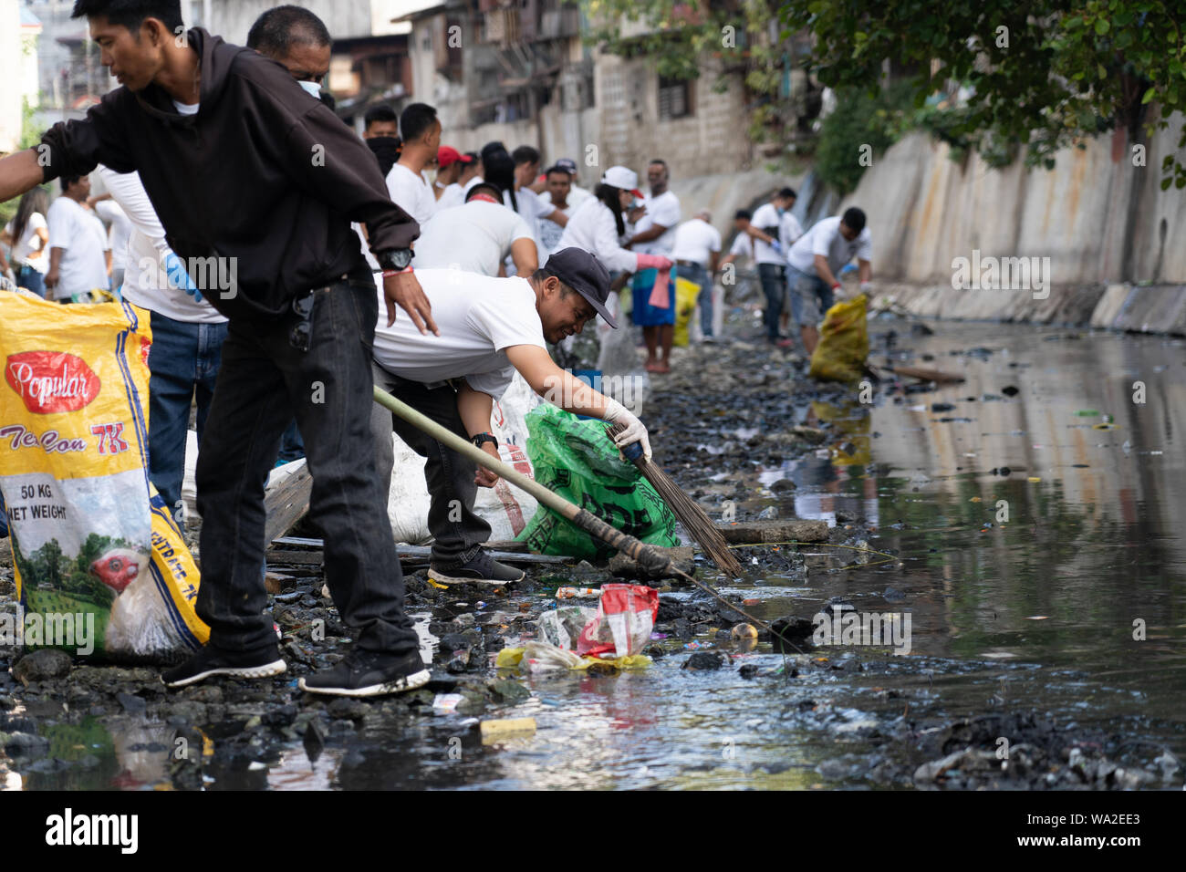 Collecting Waste From A River High Resolution Stock Photography and ...