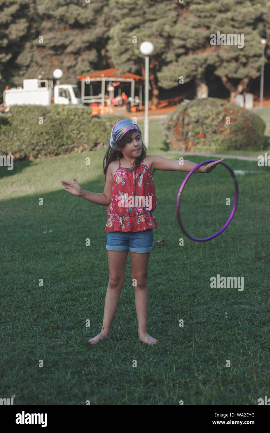 Hula hooping children hi-res stock photography and images - Alamy