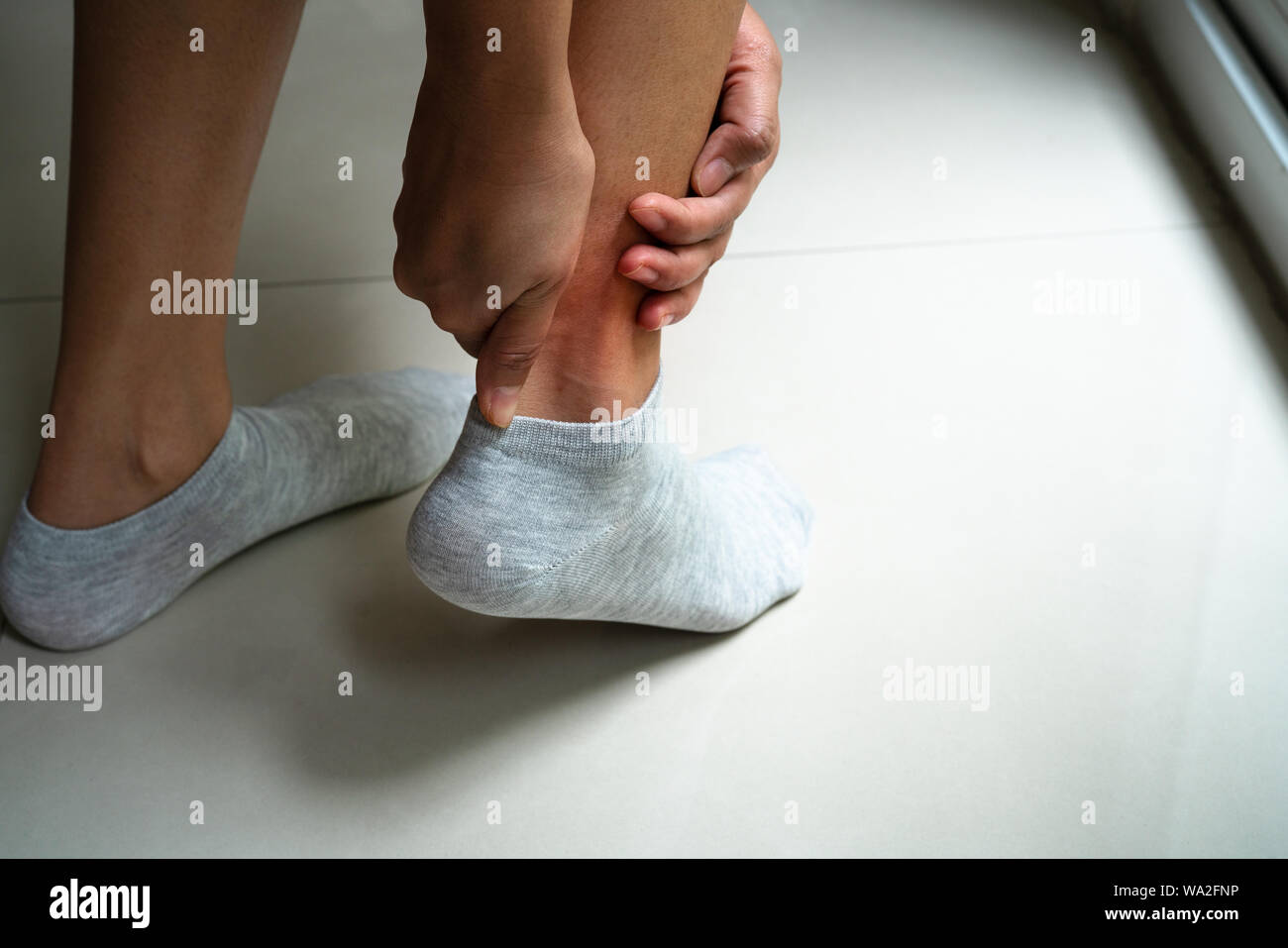 women leg ankle injury/painful, women touch the pain ankle leg Stock ...