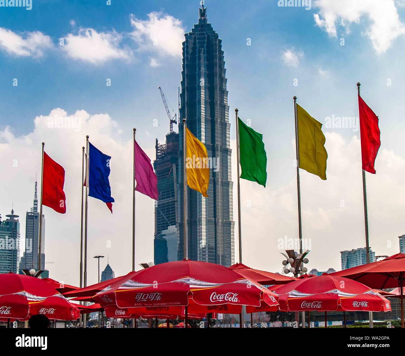 Shanghai, China. 30th Oct, 2006. Colorful flags fly above the bright ...