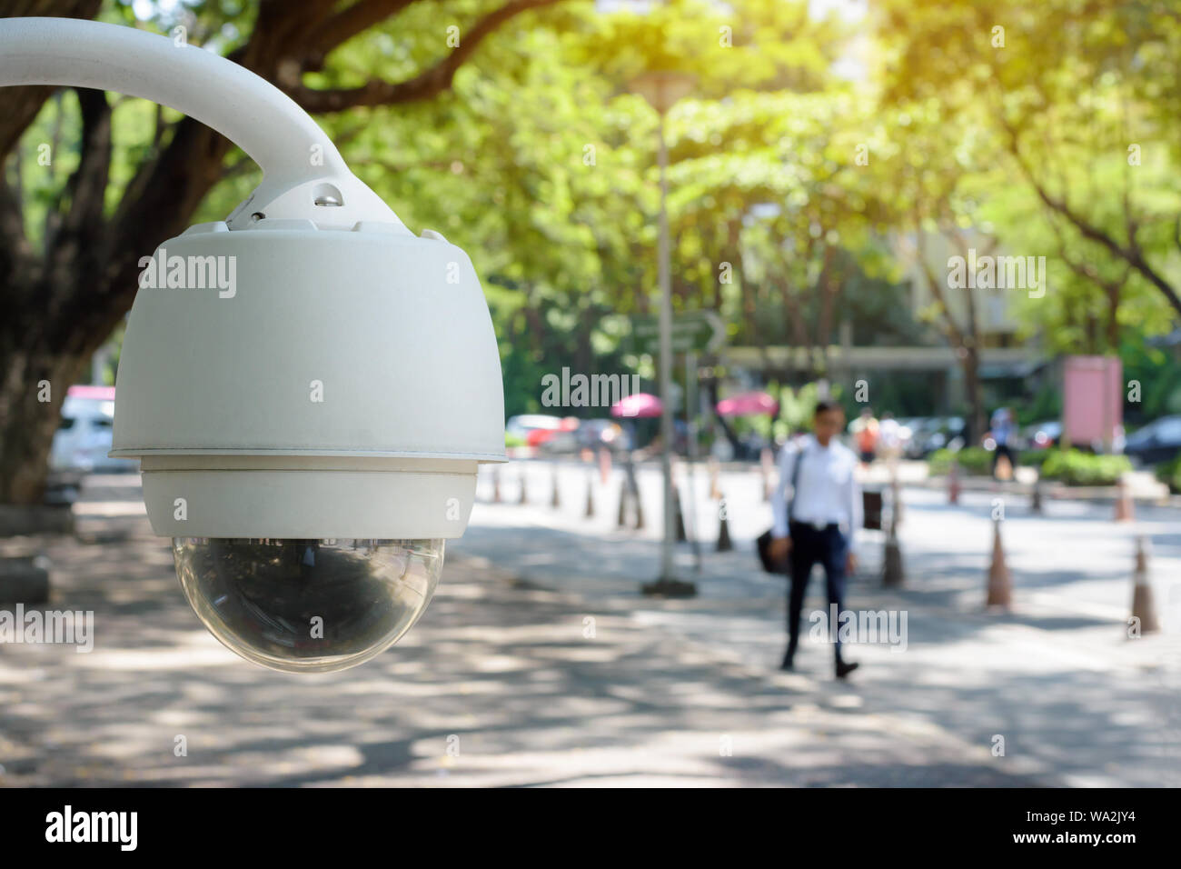 Security camera CCTV monitoring on the public area. While people ...