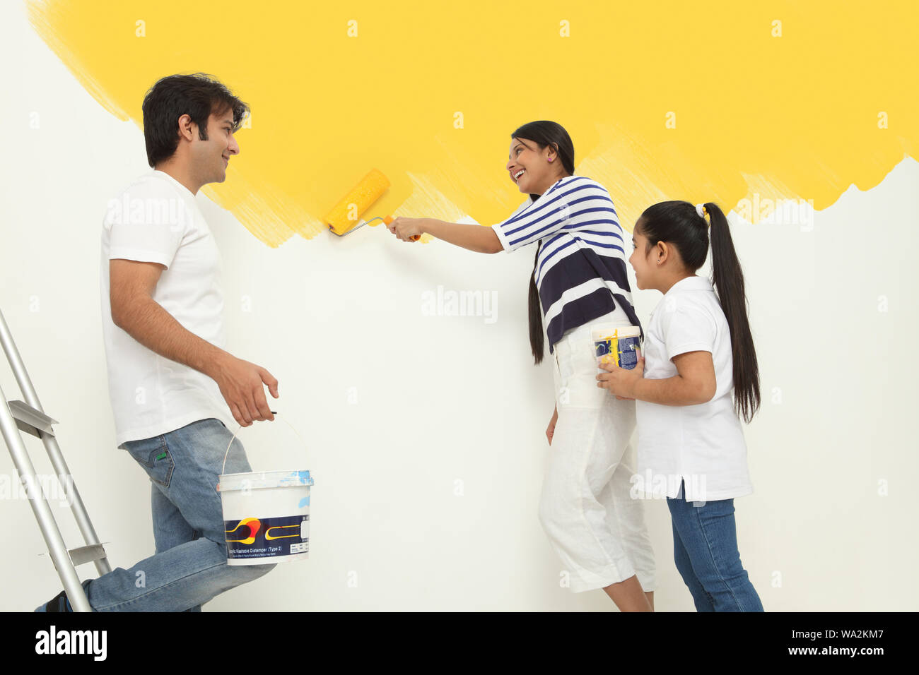 Family painting on wall Stock Photo - Alamy