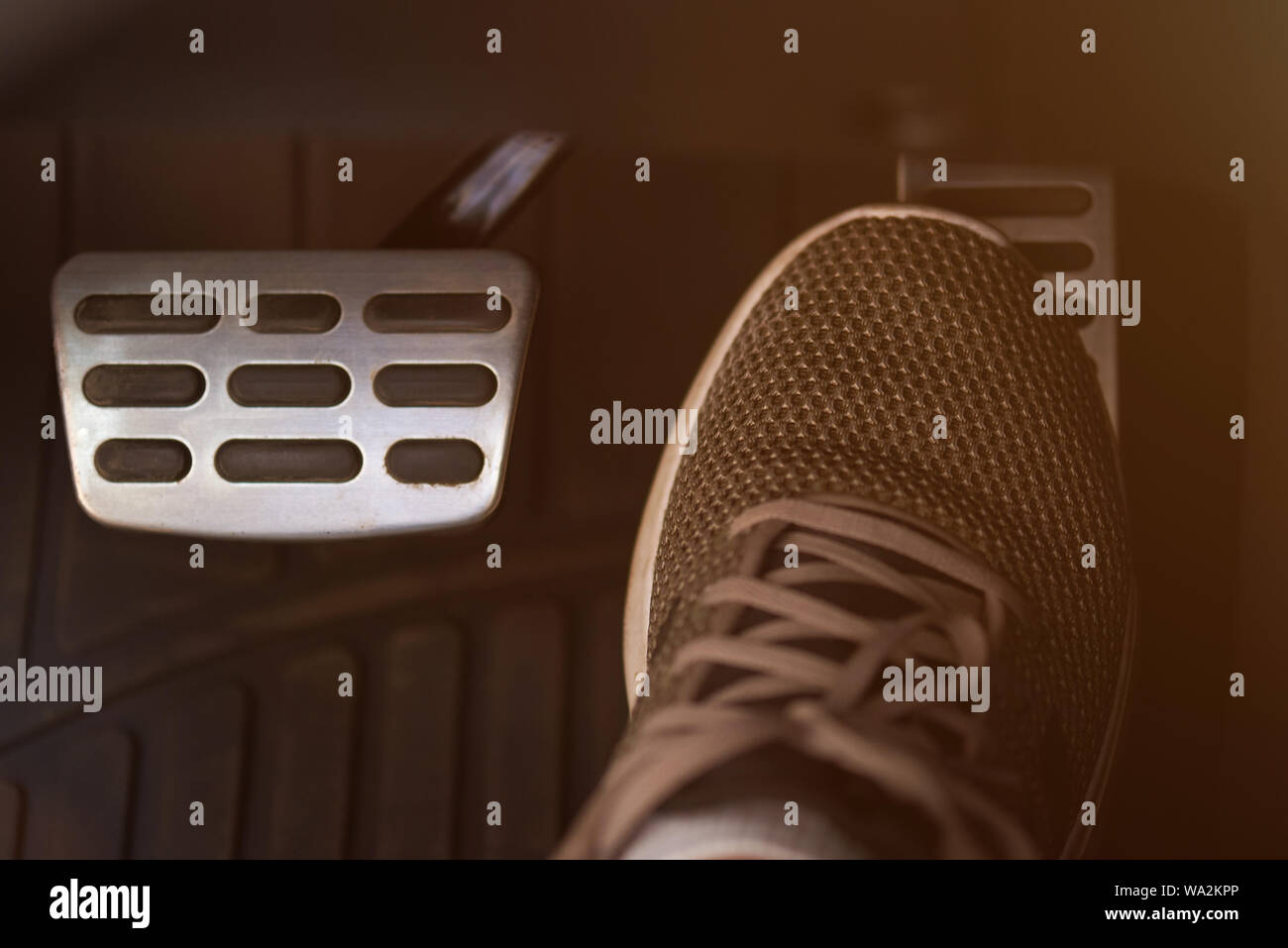 Pressing accelerator car pedal with shoe close-up view Stock Photo - Alamy