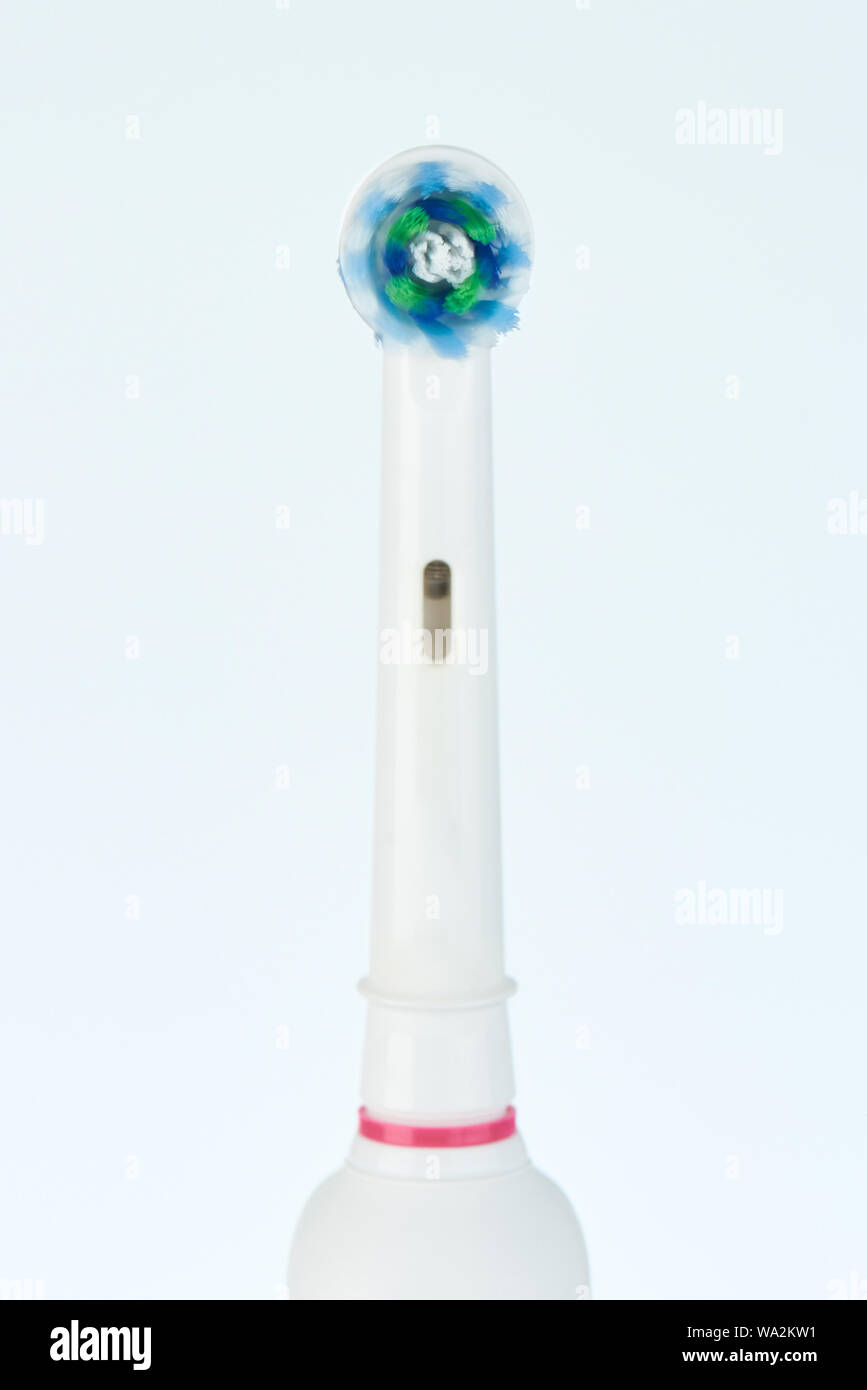 Dental clean theme. Macro of spinning electrical toothbrush Stock Photo ...