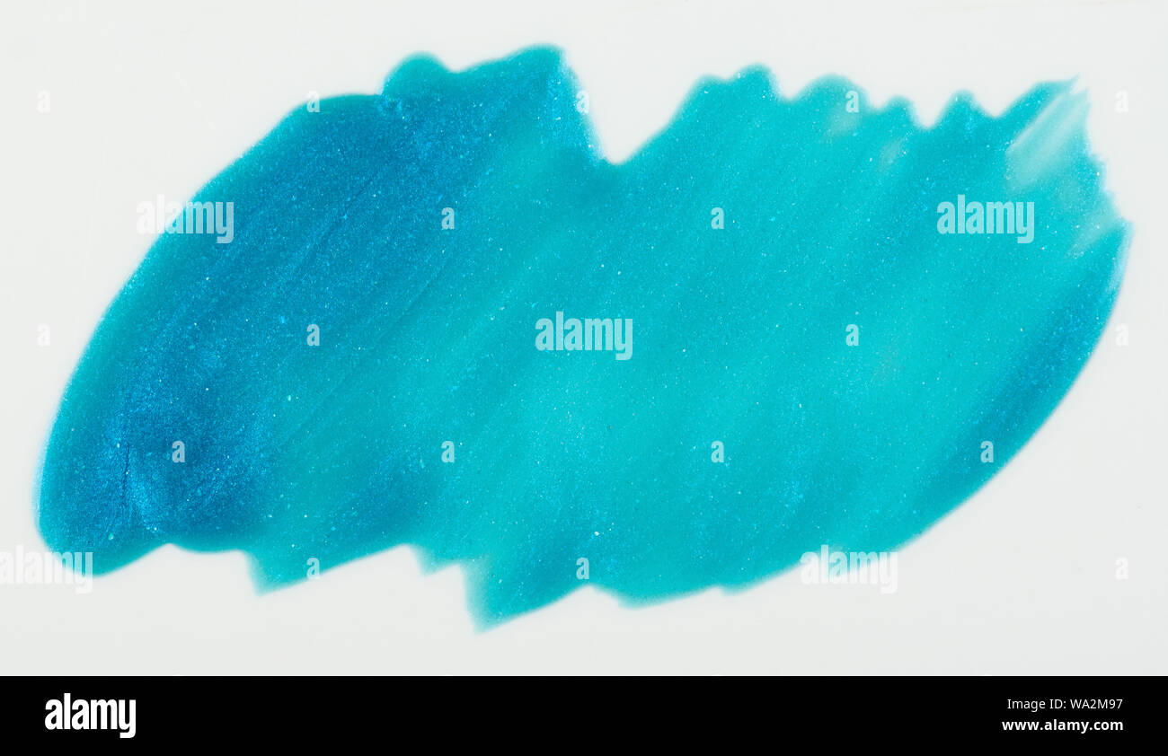 Sparkle blue paint stain isolated on white background close up view ...