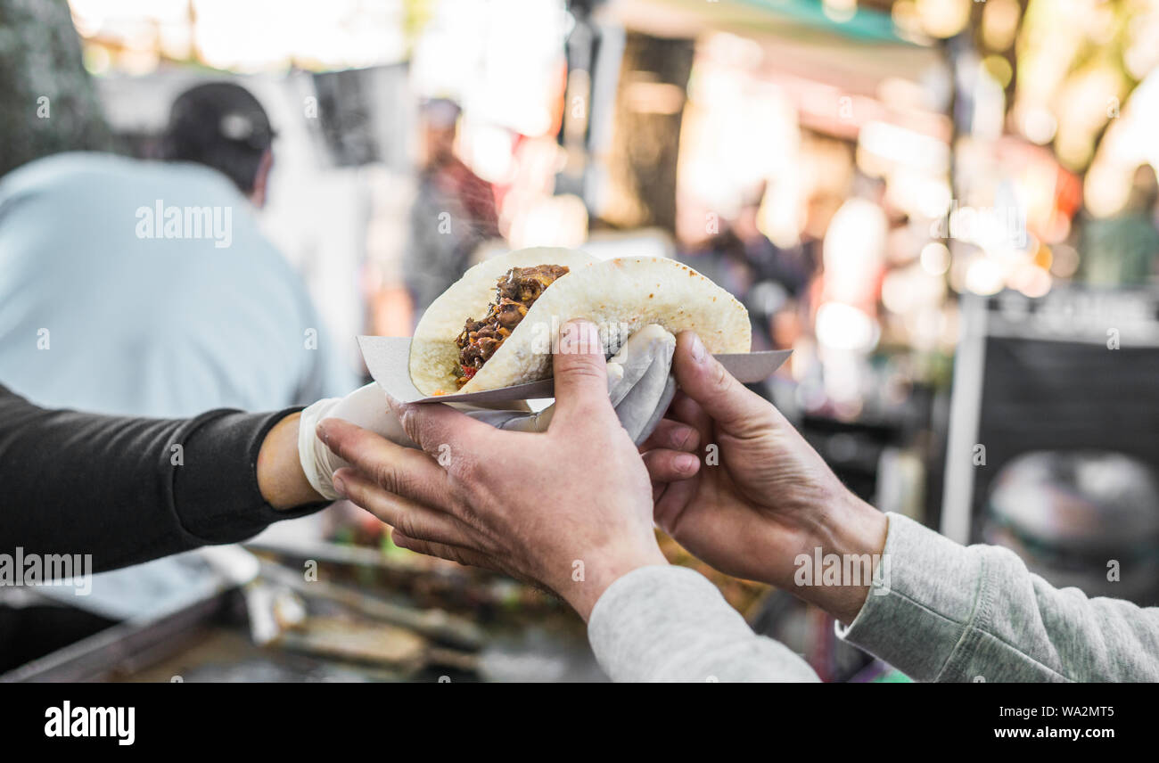 Chef at a street food market preparing a taco Stock Photo - Alamy