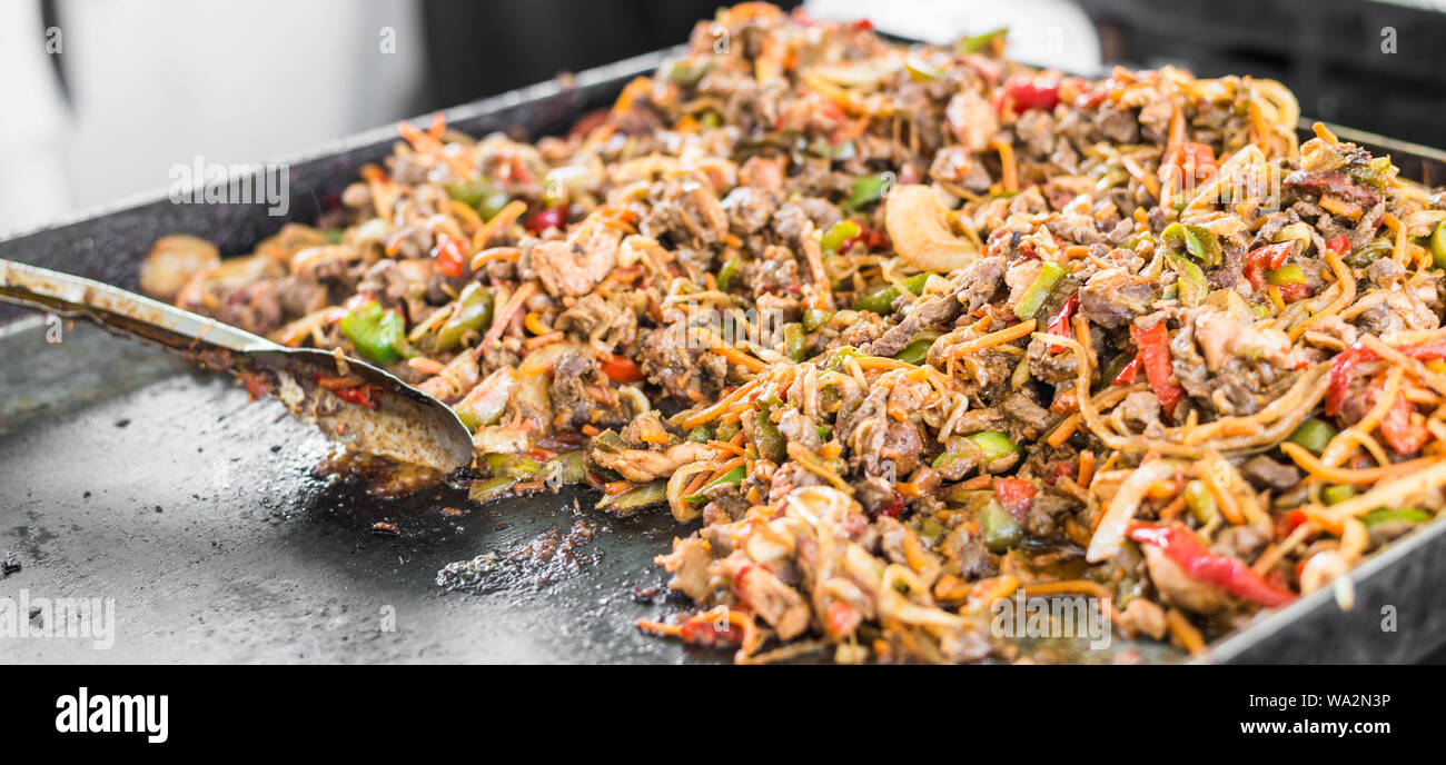 Taco ingredients cooking at a street food market Stock Photo - Alamy