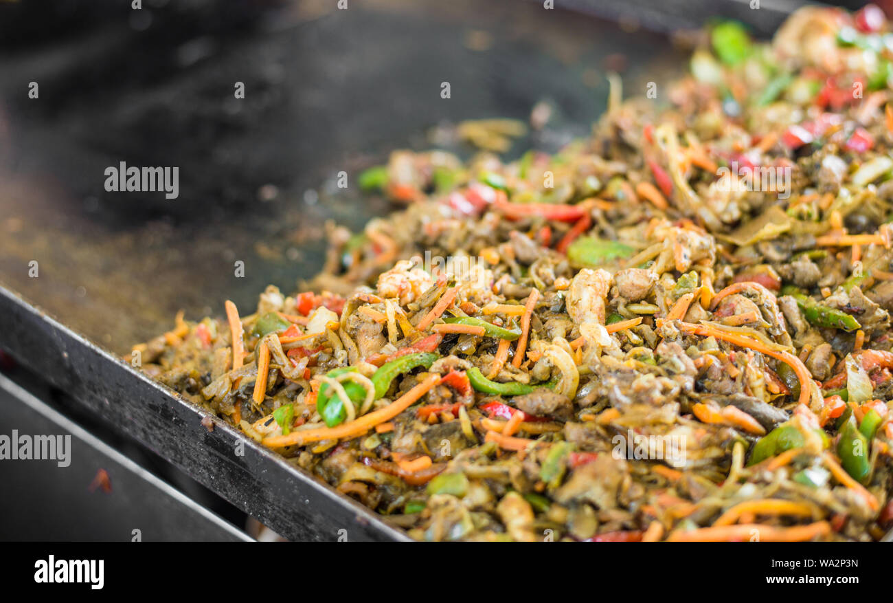 Taco ingredients cooking at a street food market Stock Photo - Alamy