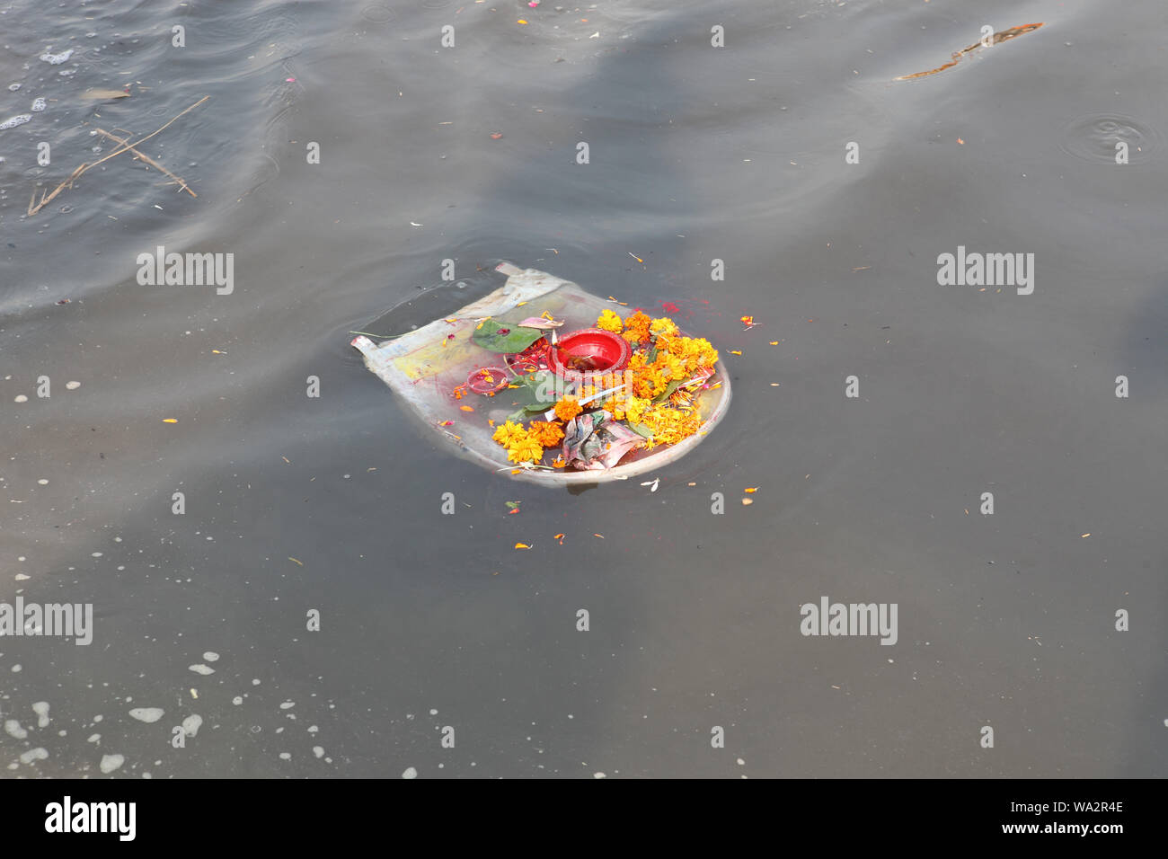 Diya floating in a river Stock Photo - Alamy